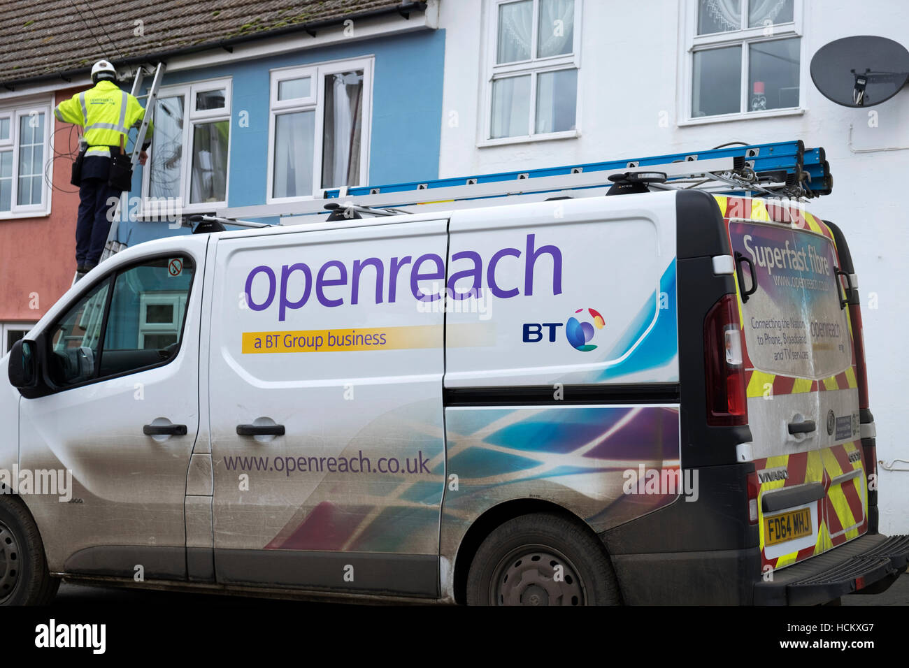 BT engineer connecting telephone line to residential property, Alderton ...