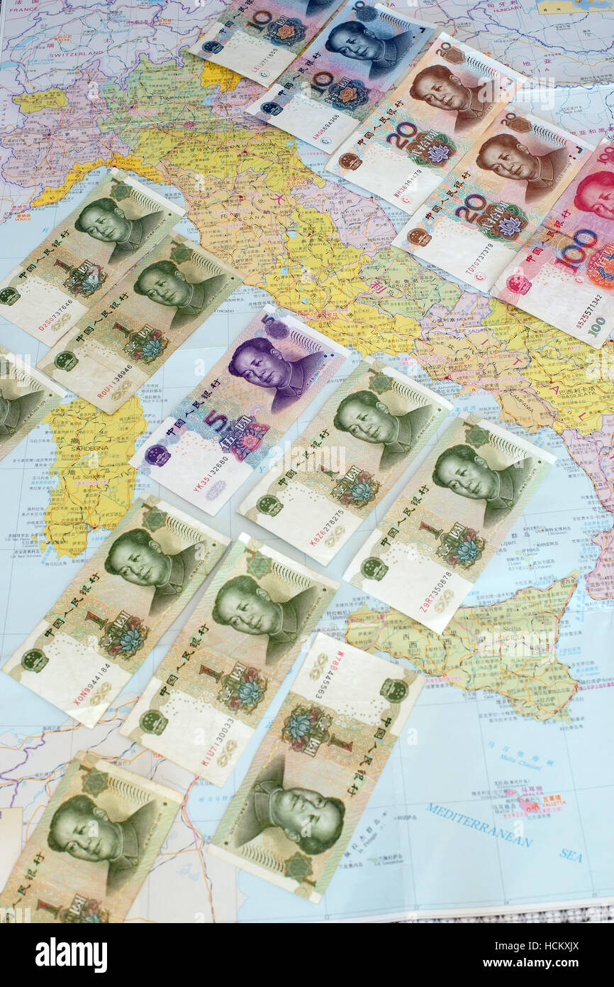 chinese yuan banknote on italian map. symbolizes economic and financial ...