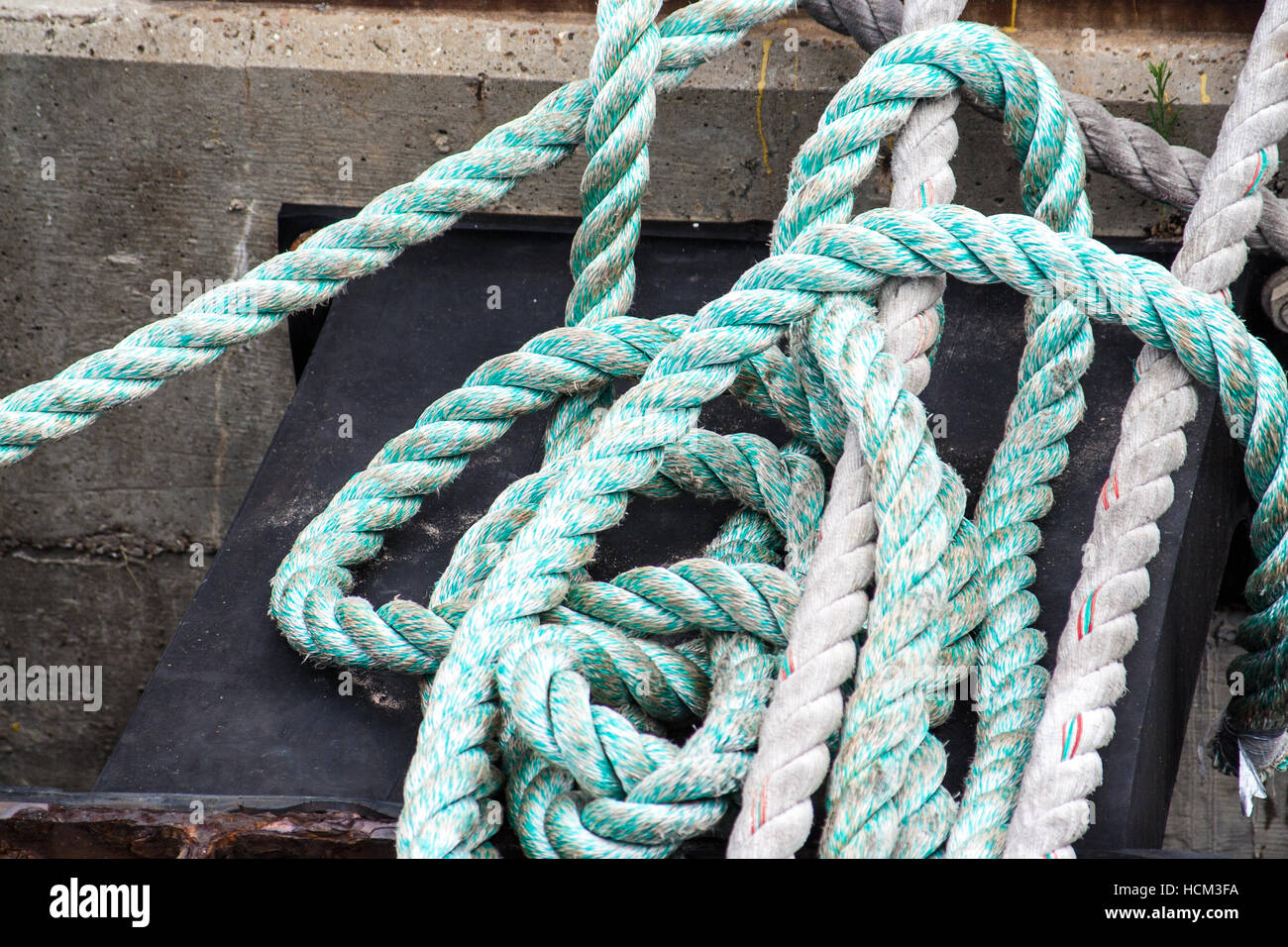 Blue and white ropes from a boat Stock Photo - Alamy
