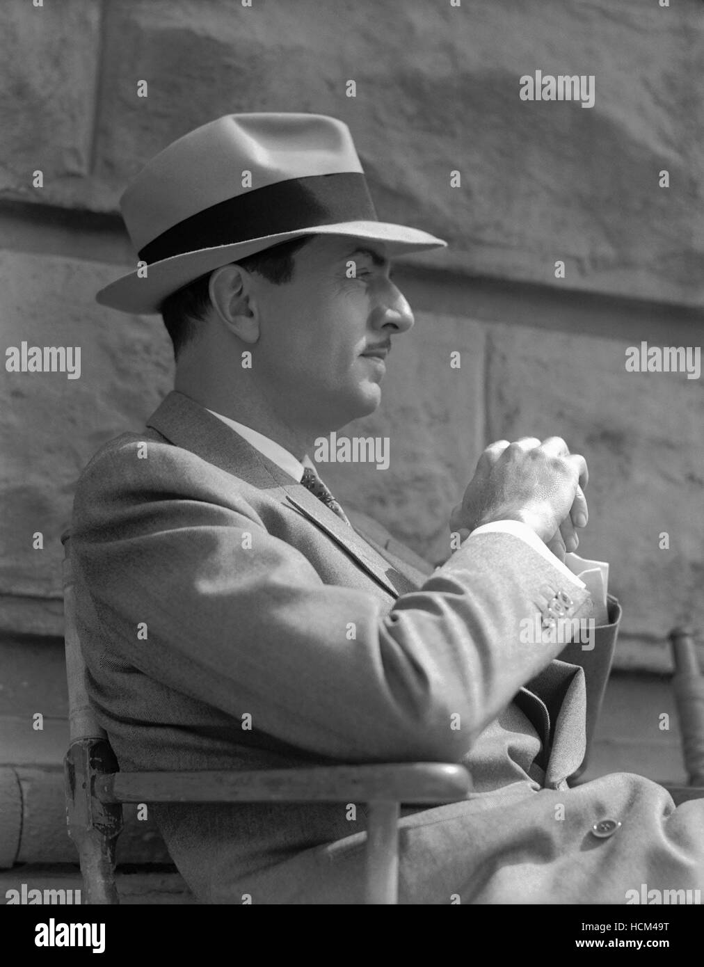 William Powell relaxes on the set of SHADOW OF THE THIN MAN, 1941 Stock ...