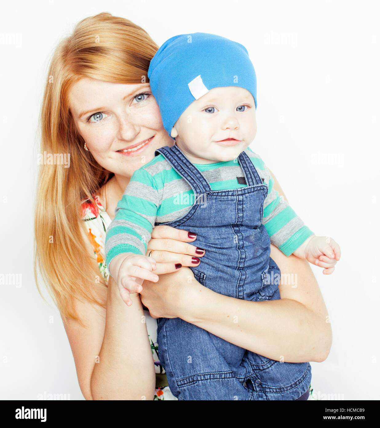 young beauty mother with cute baby, red head happy modern family ...
