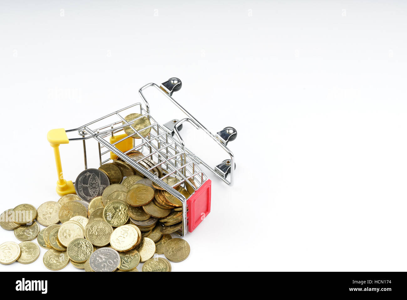Toy trolley and coin with white background. Financial concept Stock ...