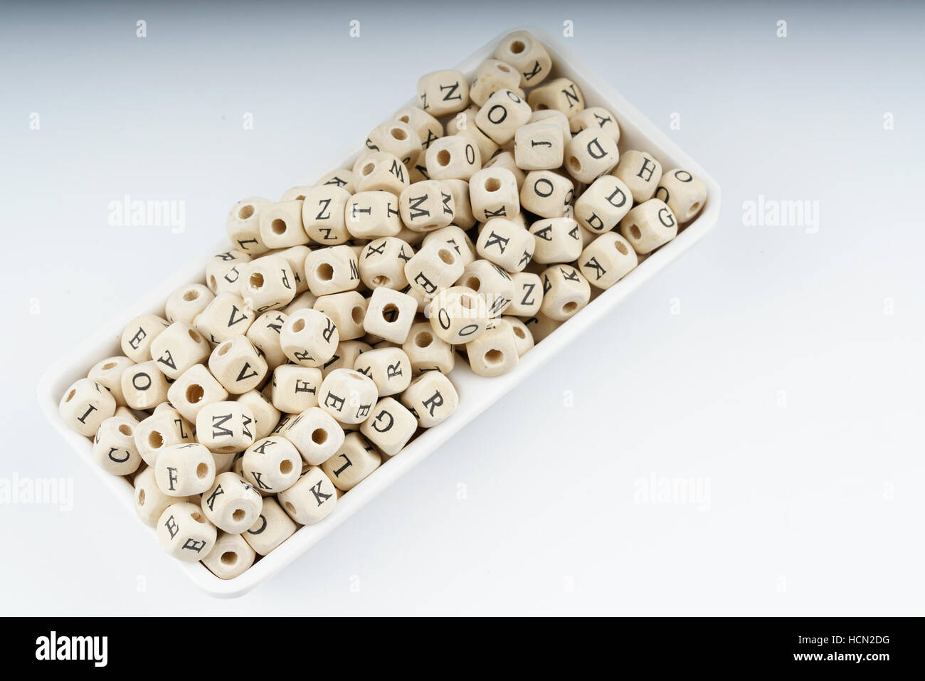 Wooden letter cube with white background Stock Photo - Alamy