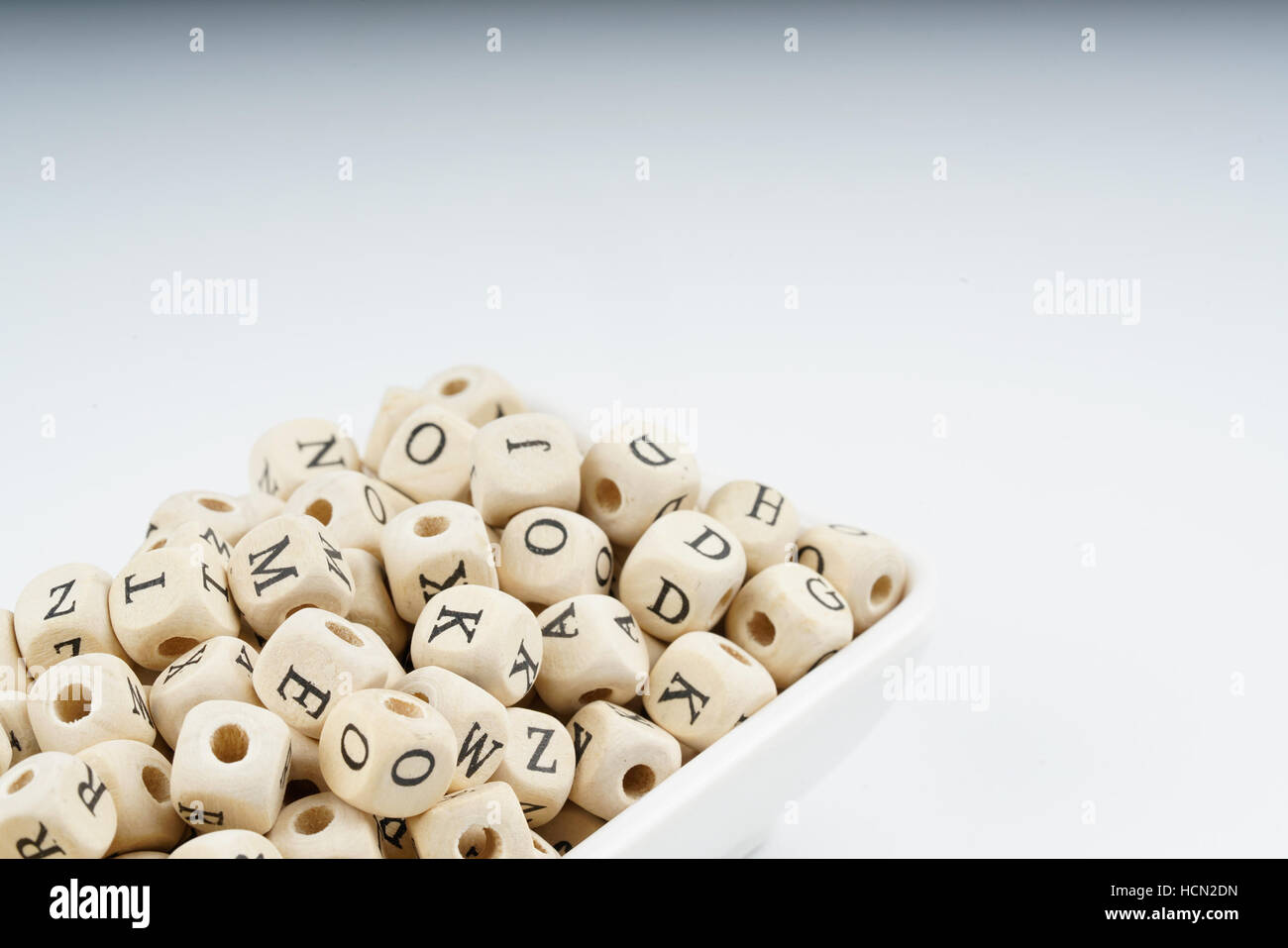 Wooden letter cube with white background Stock Photo - Alamy