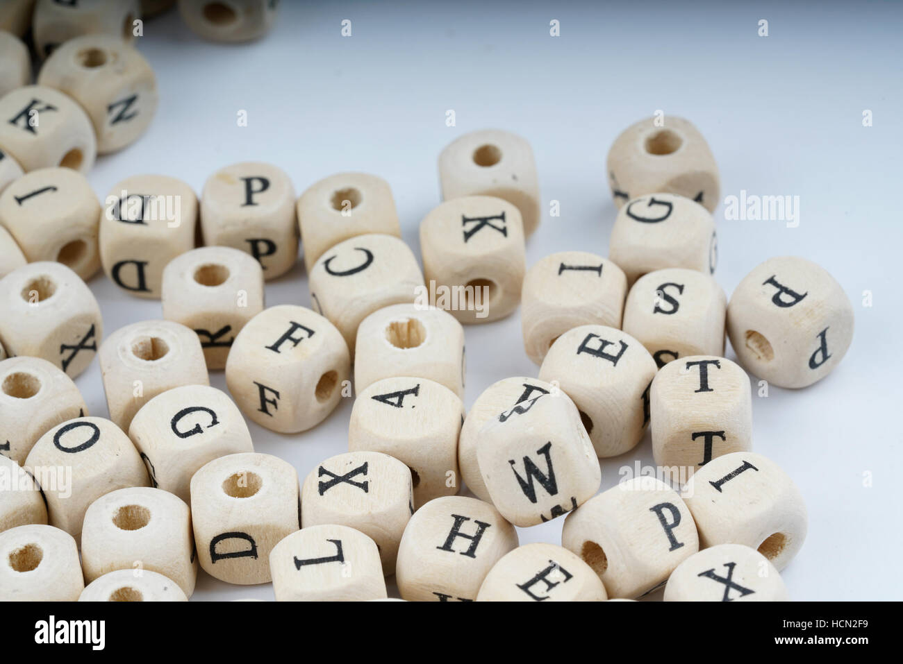 Wooden letter cube with white background Stock Photo - Alamy