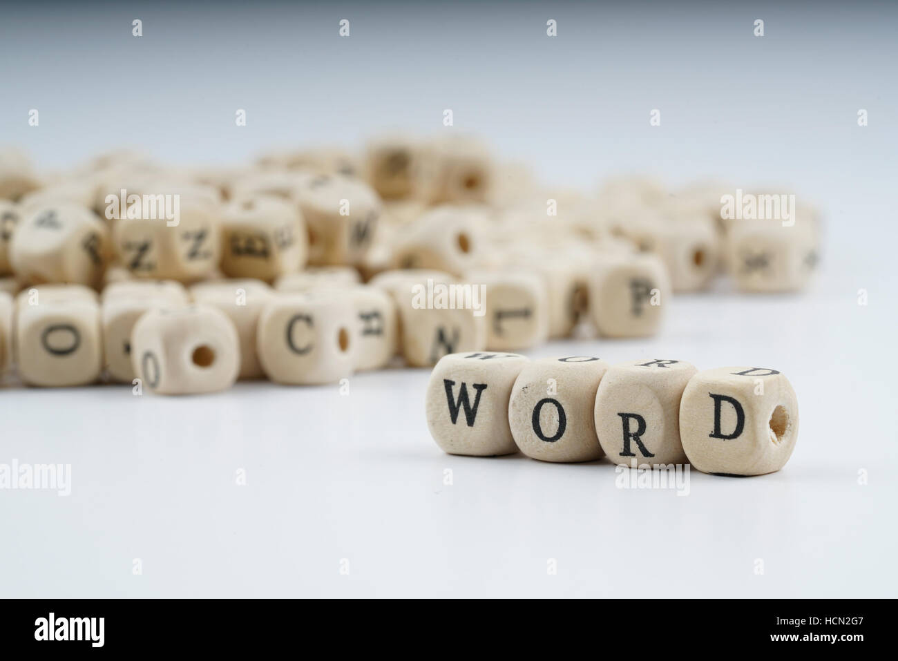 Wooden letter cube with white background Stock Photo - Alamy