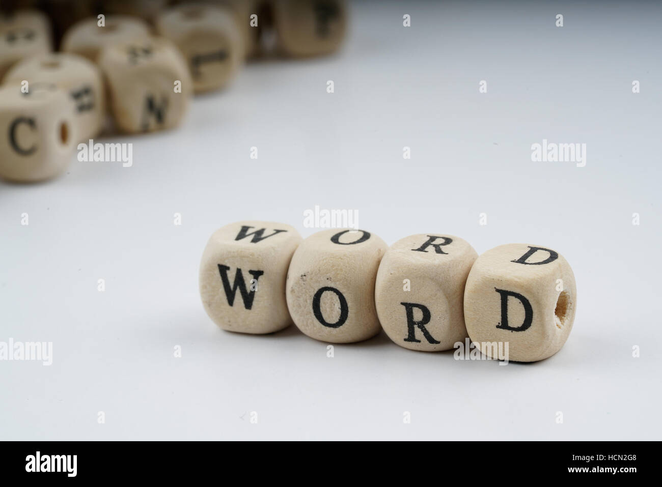 Wooden letter cube with white background Stock Photo - Alamy