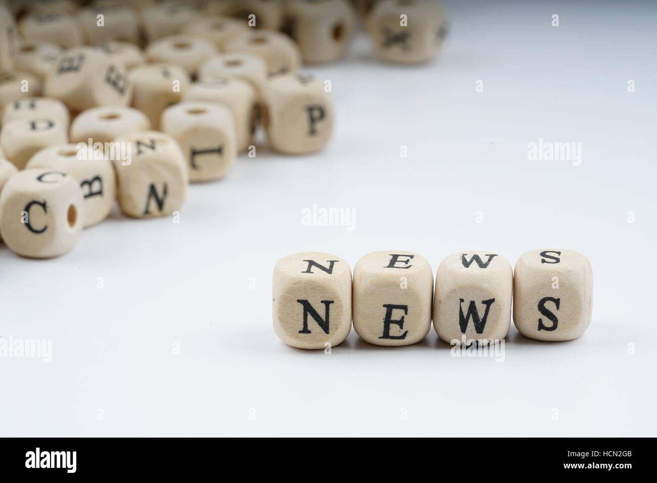 Wooden letter cube with white background Stock Photo - Alamy