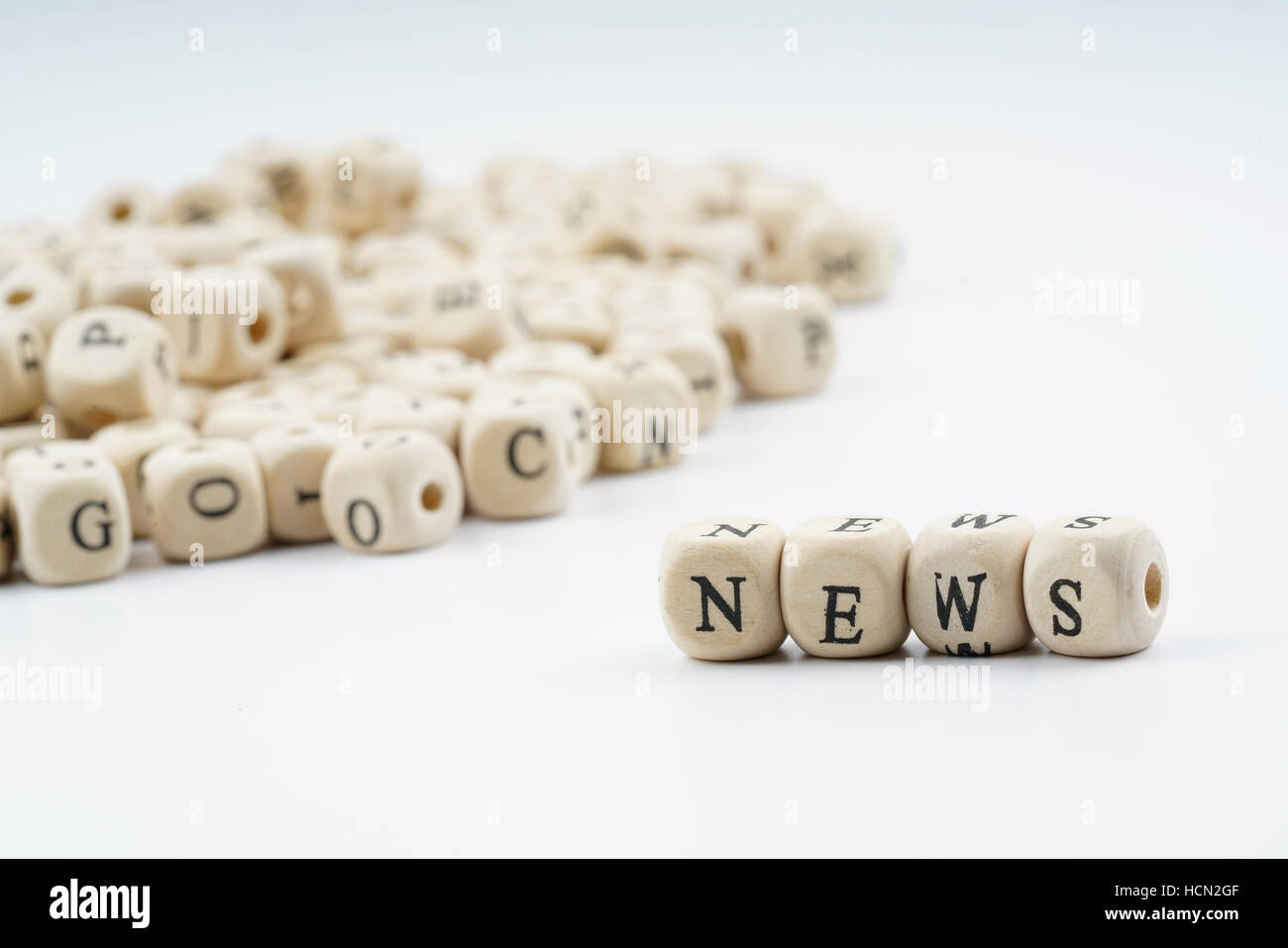Wooden letter cube with white background Stock Photo - Alamy