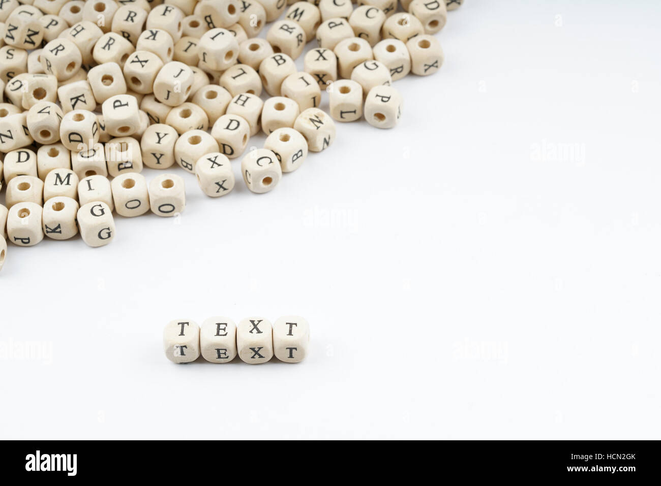 Wooden letter cube with white background Stock Photo - Alamy