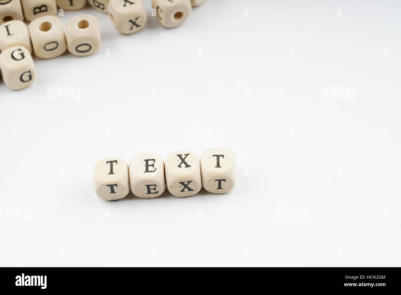 Wooden letter cube with white background Stock Photo - Alamy