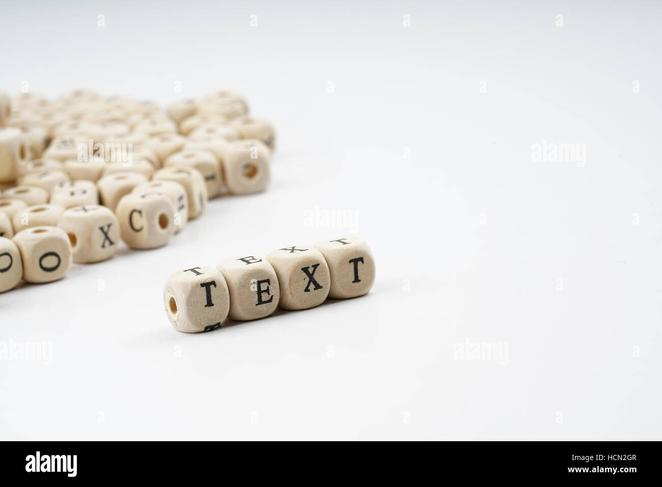Wooden letter cube with white background Stock Photo - Alamy
