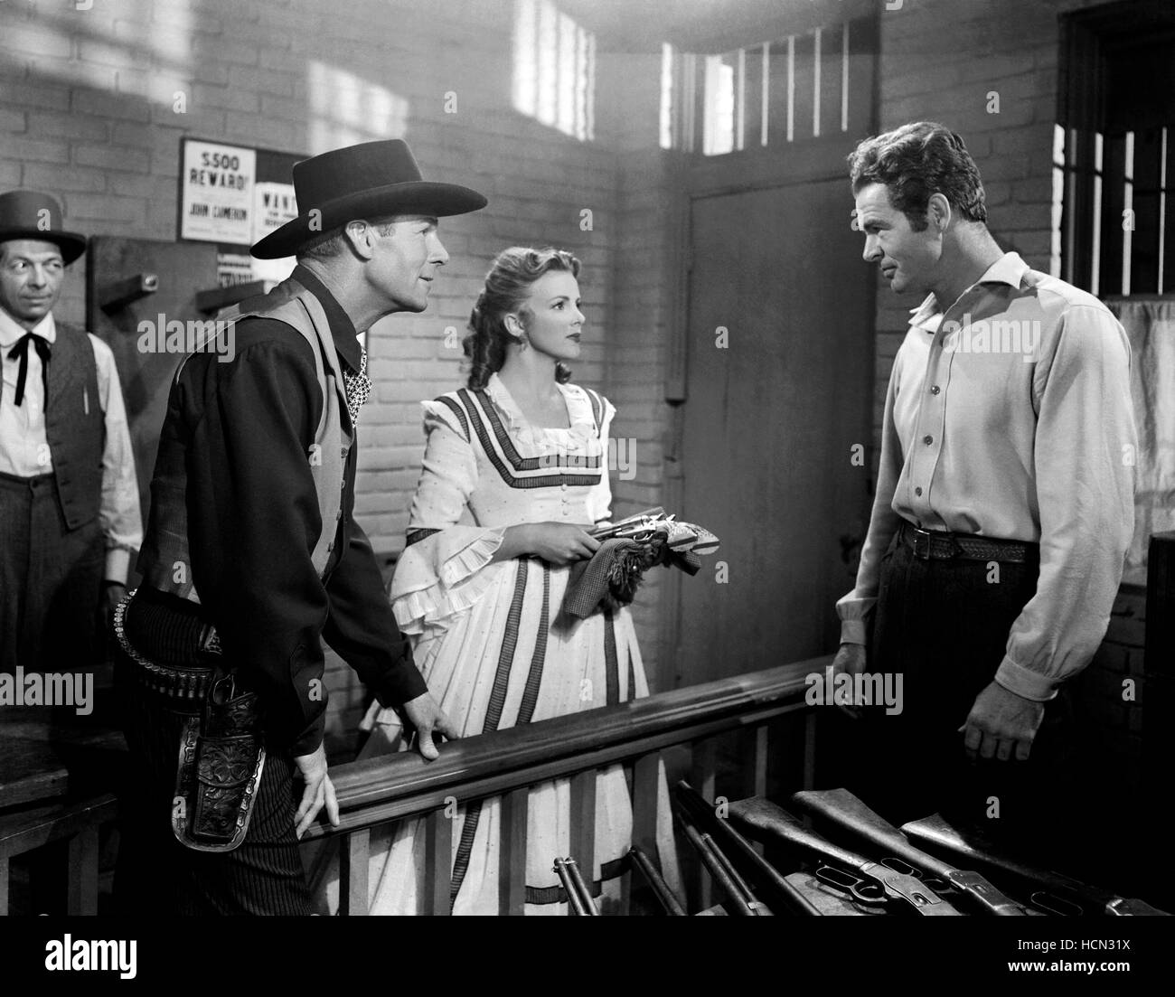 TRAIL STREET, front from left: Randolph Scott as Bat Masterson, Madge ...