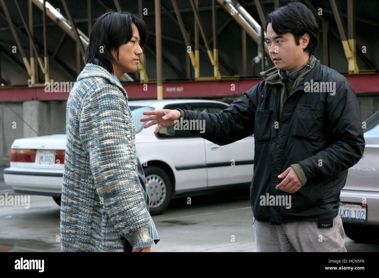 UNDOING, Sung Kang, director Chris Chan Lee, on set, 2006. ©Indican ...