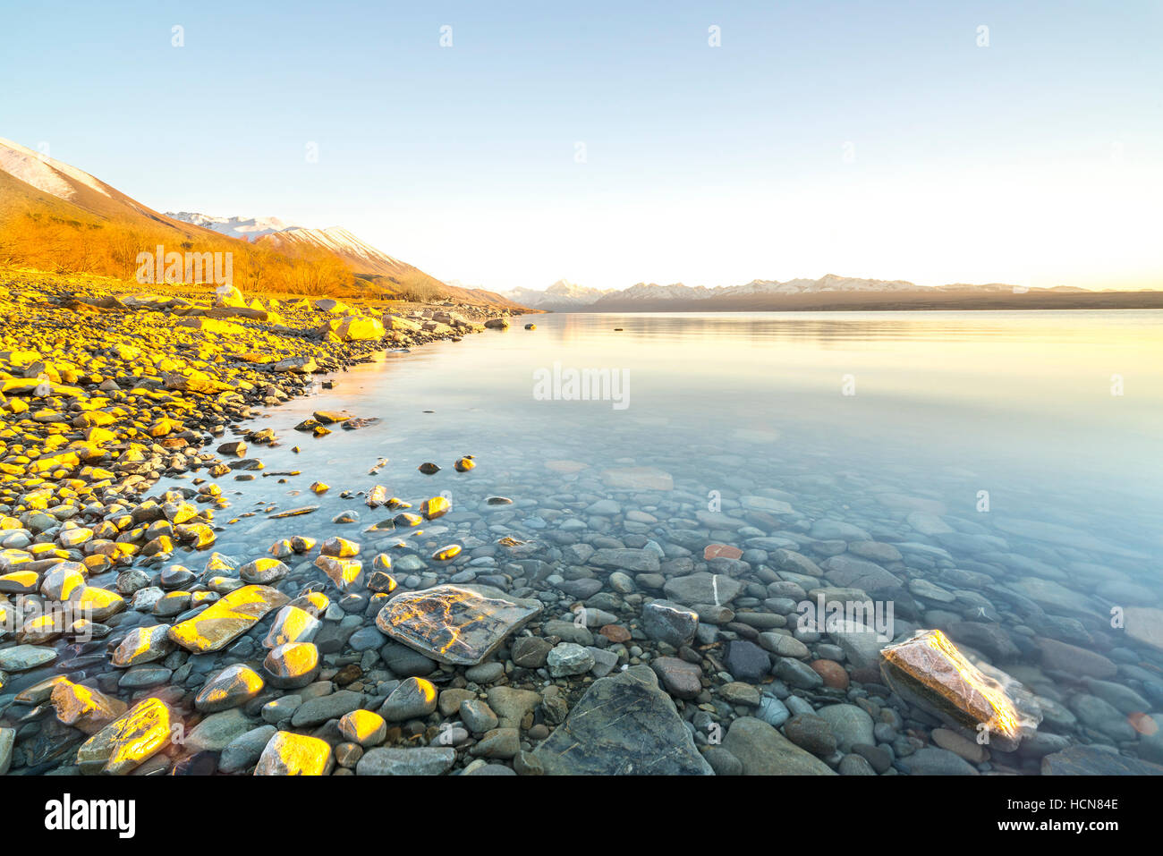 Stone lake with sunrise sunlight Stock Photo - Alamy