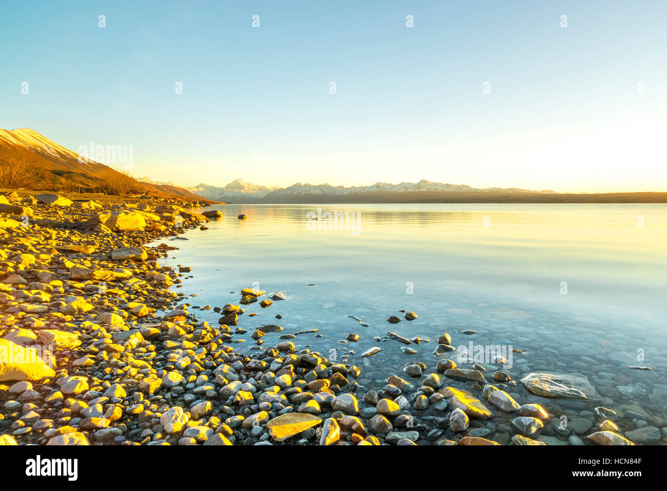 Stone lake with sunrise sunlight Stock Photo - Alamy