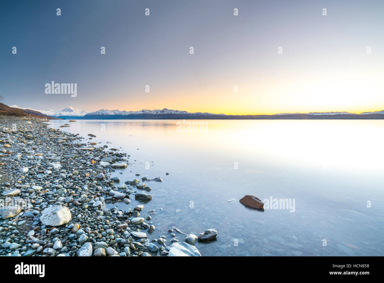 Stone lake with sunrise background Stock Photo - Alamy