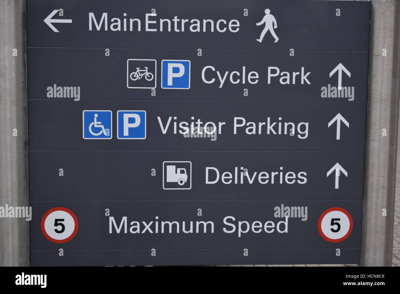 Small street sign showing direction in a busy city district Stock Photo ...