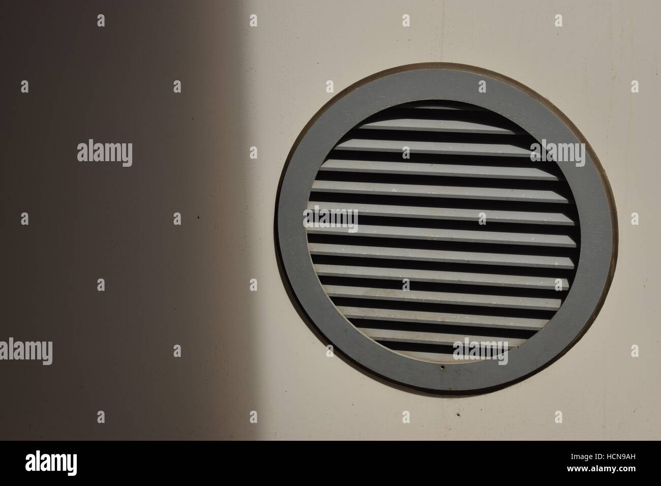 Small circular air vent a line of shadow Stock Photo - Alamy
