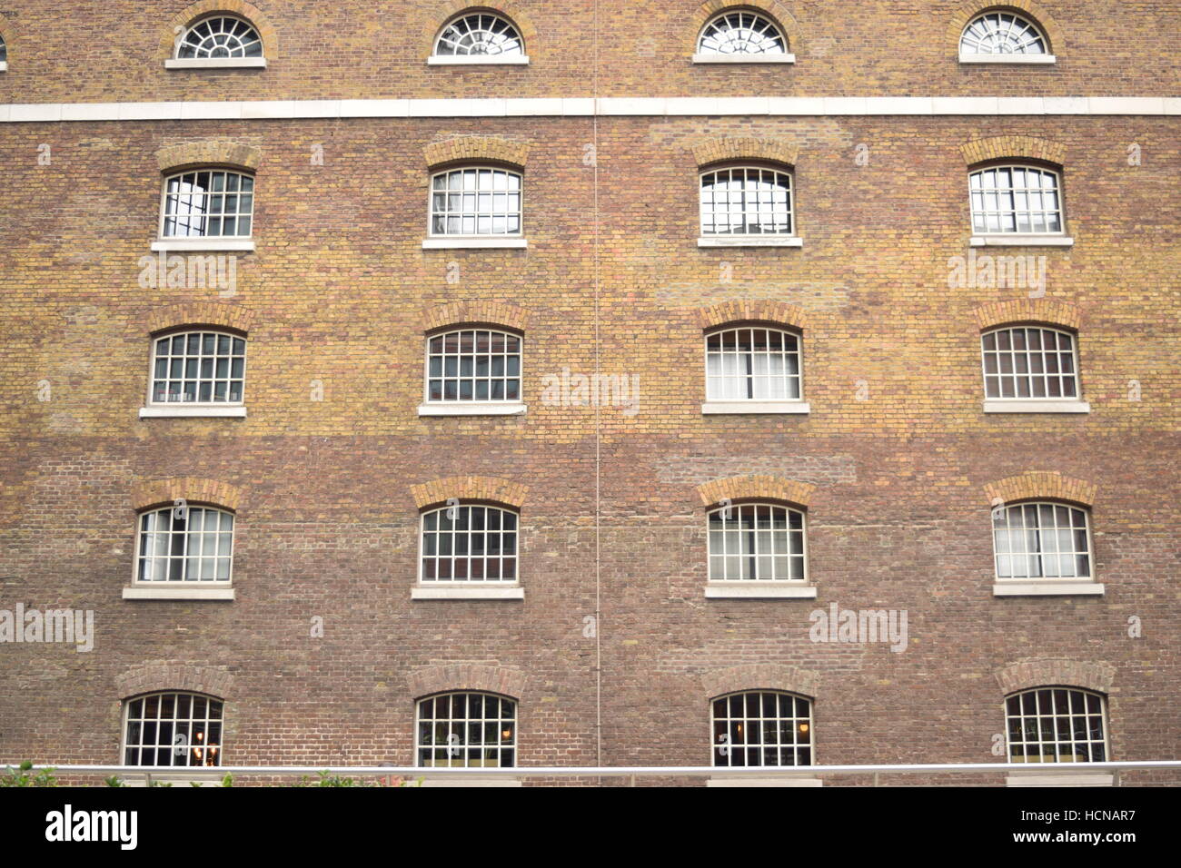 Tall office building with locked windows Stock Photo - Alamy