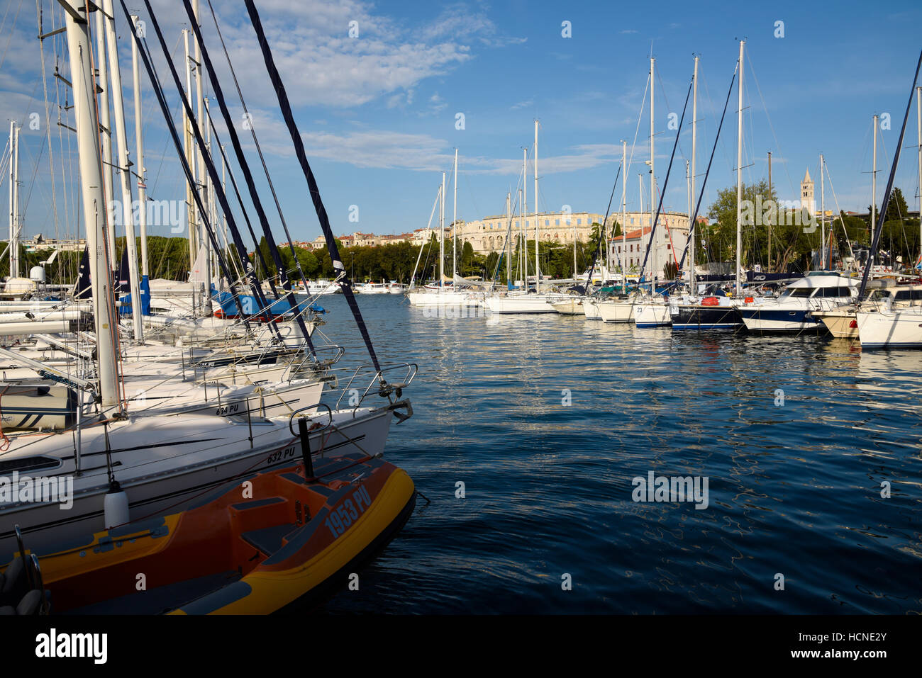 Pula: Sailing boats in the marina, with roman Arena in the background ...