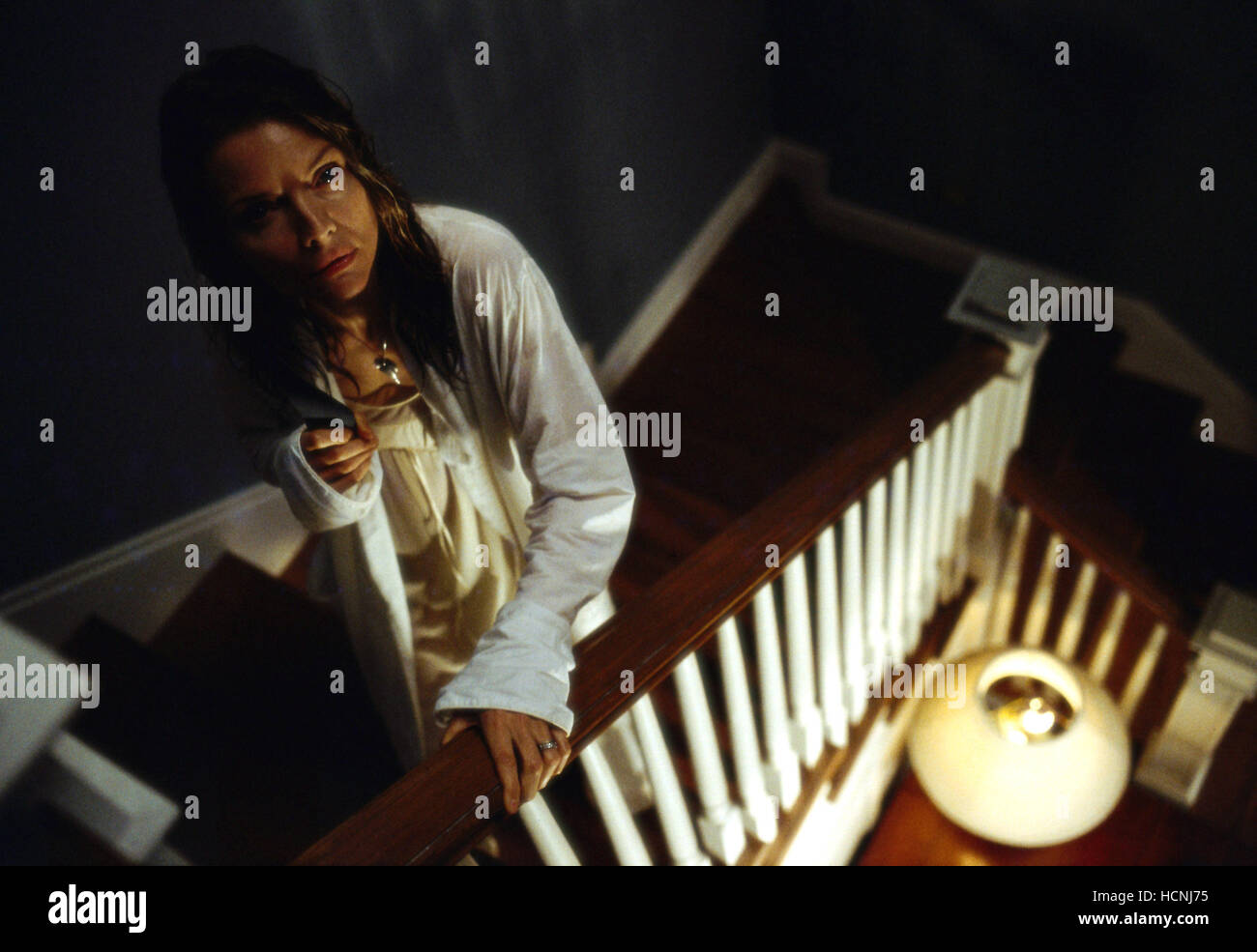 WHAT LIES BENEATH, Michelle Pfeiffer, 2000, walking up stairs Stock ...