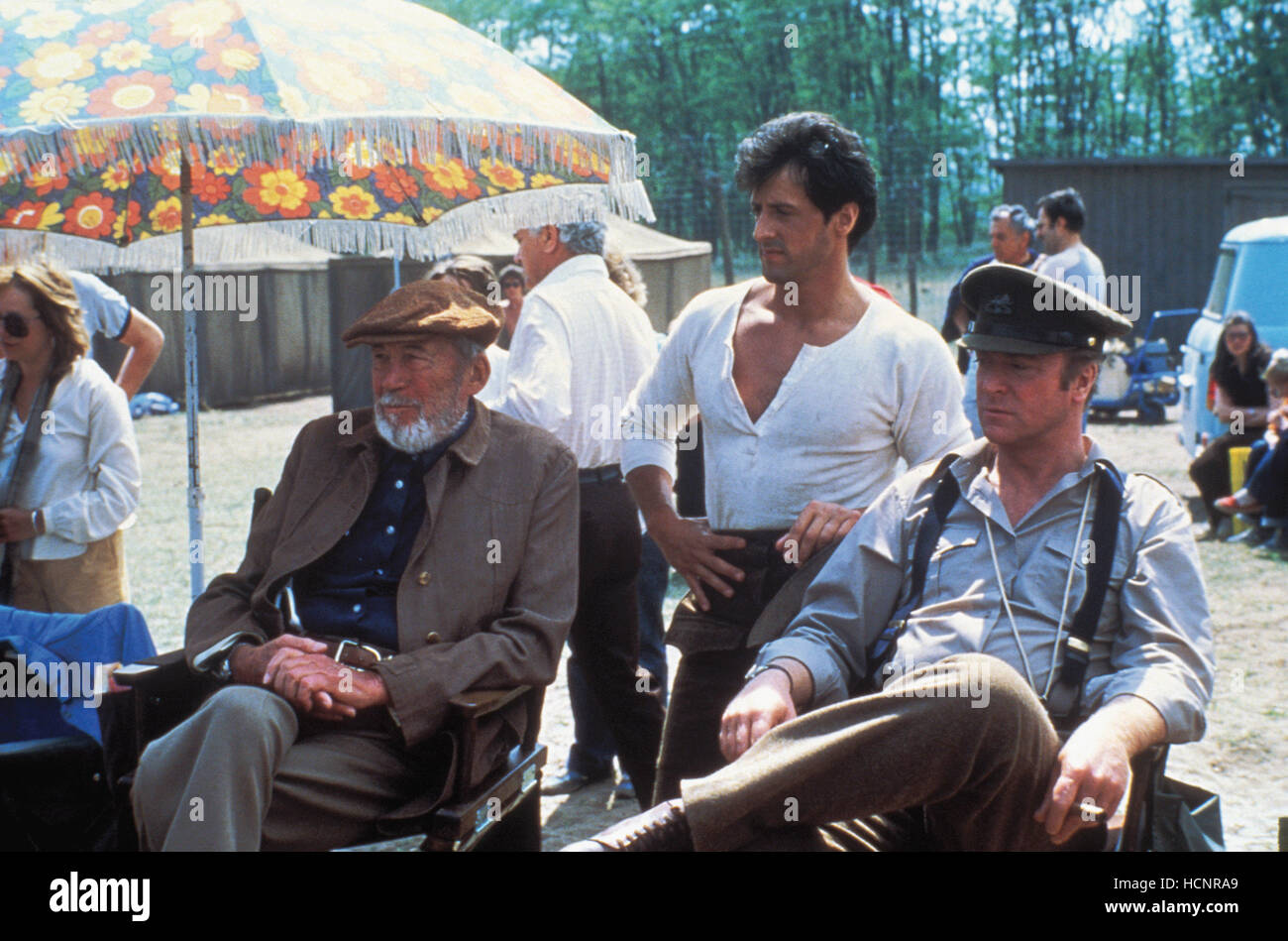 VICTORY, director John Huston, Sylvester Stallone, Michael Caine on set ...