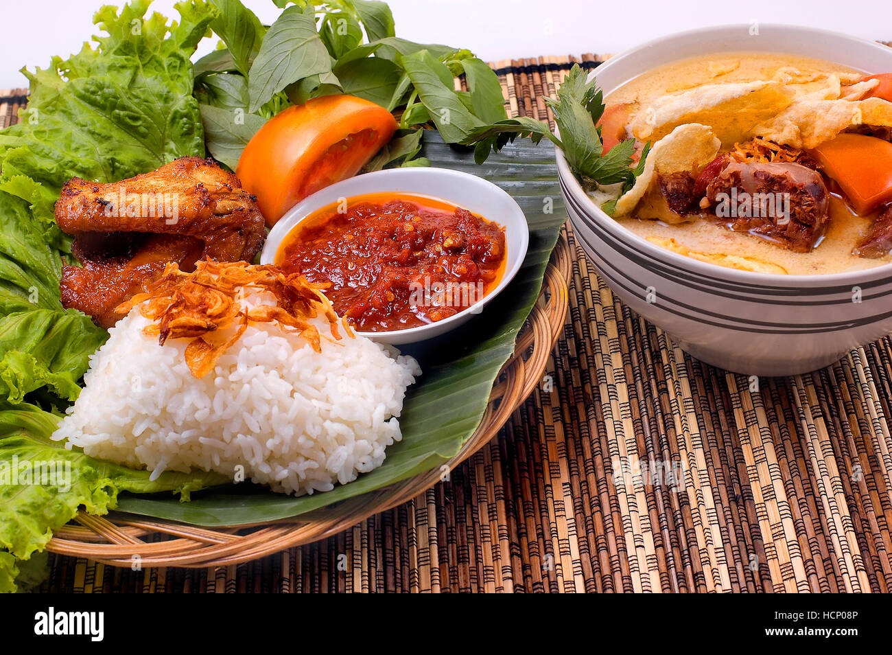 Indonesian traditional food, fried chicken and oxtail soup Stock Photo ...