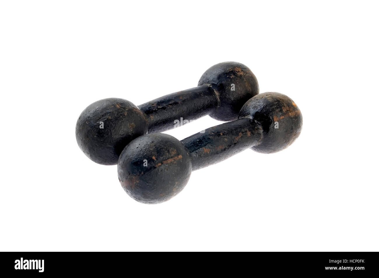 Two rusty black dumbbells on white background Stock Photo - Alamy