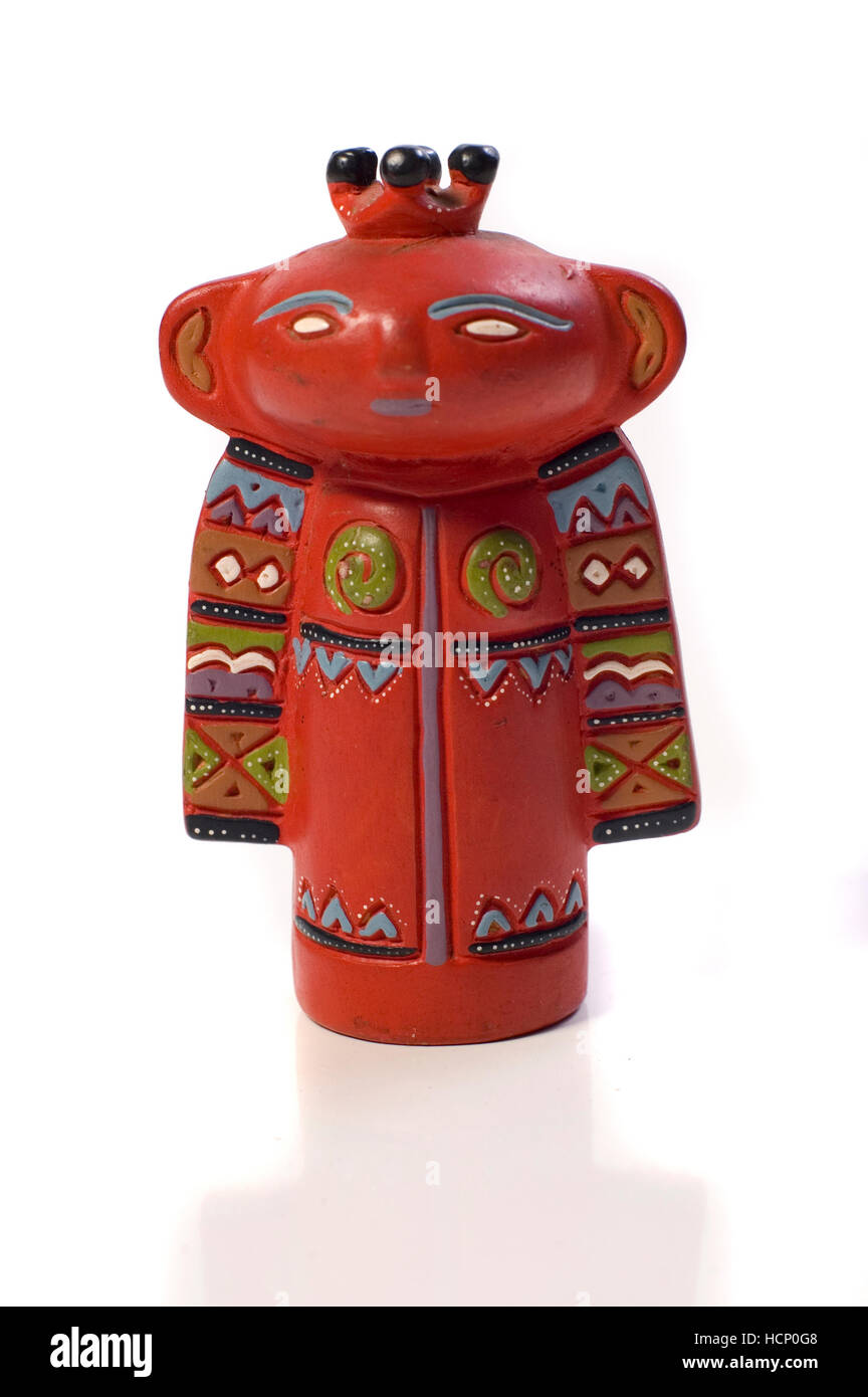 Etnic Statuewith red color and made from clay Stock Photo - Alamy