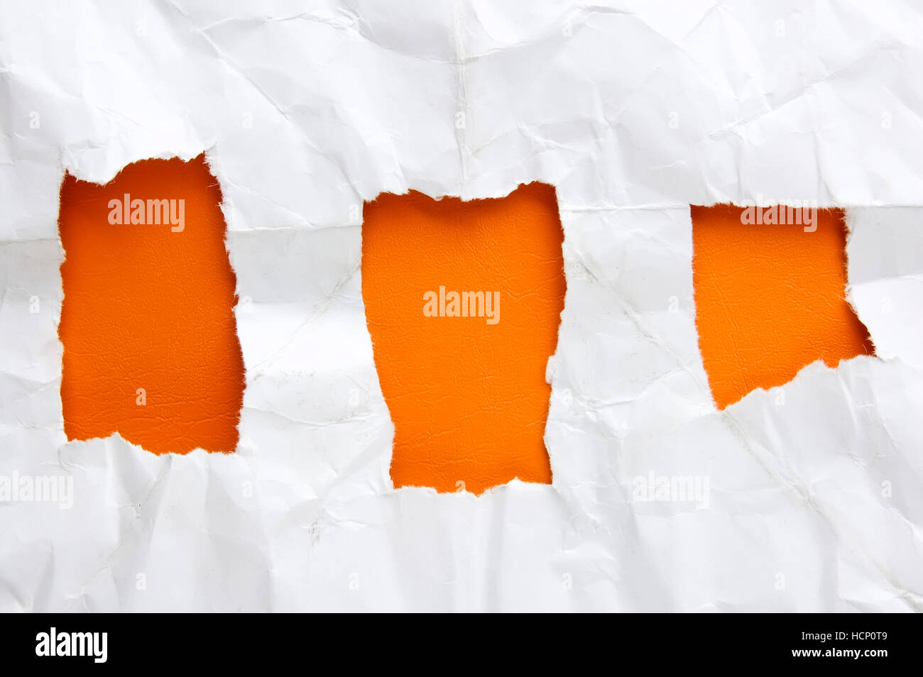 Sheet of torn paper againts orange background Stock Photo - Alamy