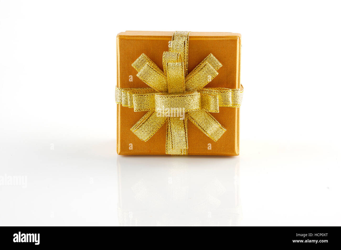 Gold christmas gift box on white background Stock Photo - Alamy