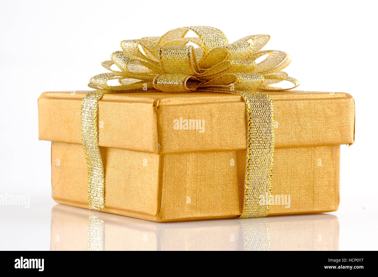 Gold christmas gift box on white background Stock Photo - Alamy