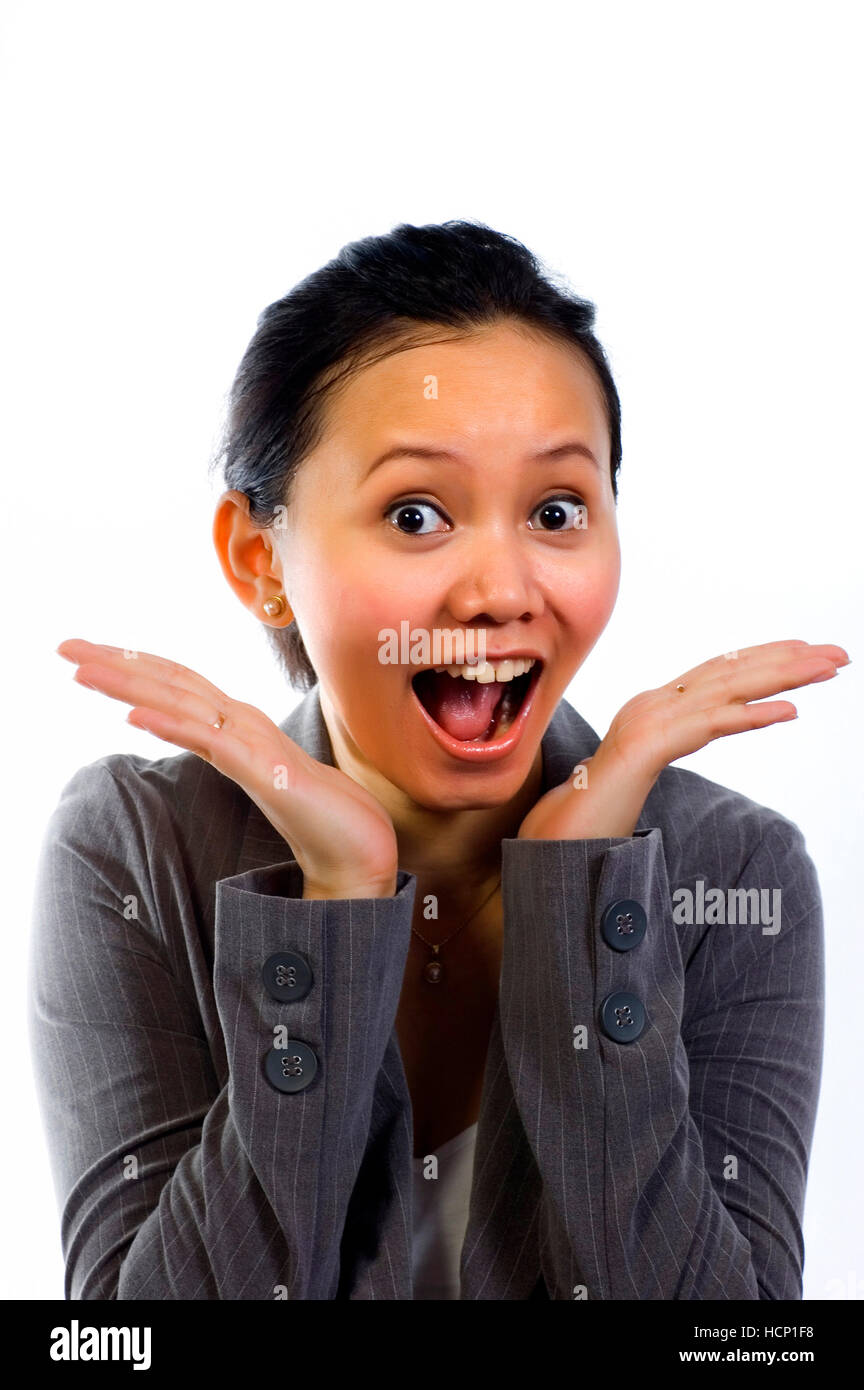Asian Woman say surprise in business suit on white background Stock ...