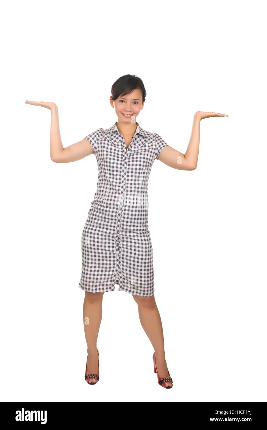 Pretty asian woman pointing, posing in full body, isolated on white ...