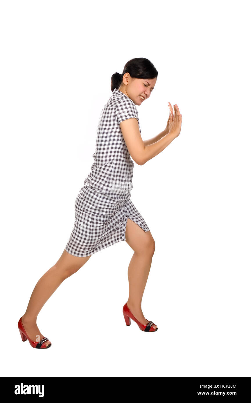 Young woman push something isolated on white background Stock Photo - Alamy