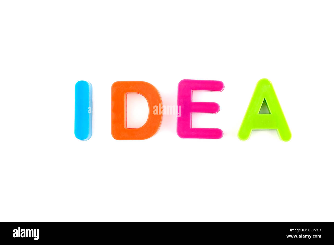 Word idea isolated on white background made from colorful toys letters ...