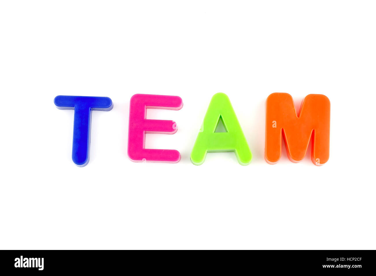 Word team isolated on white background made from colorful toys letters ...