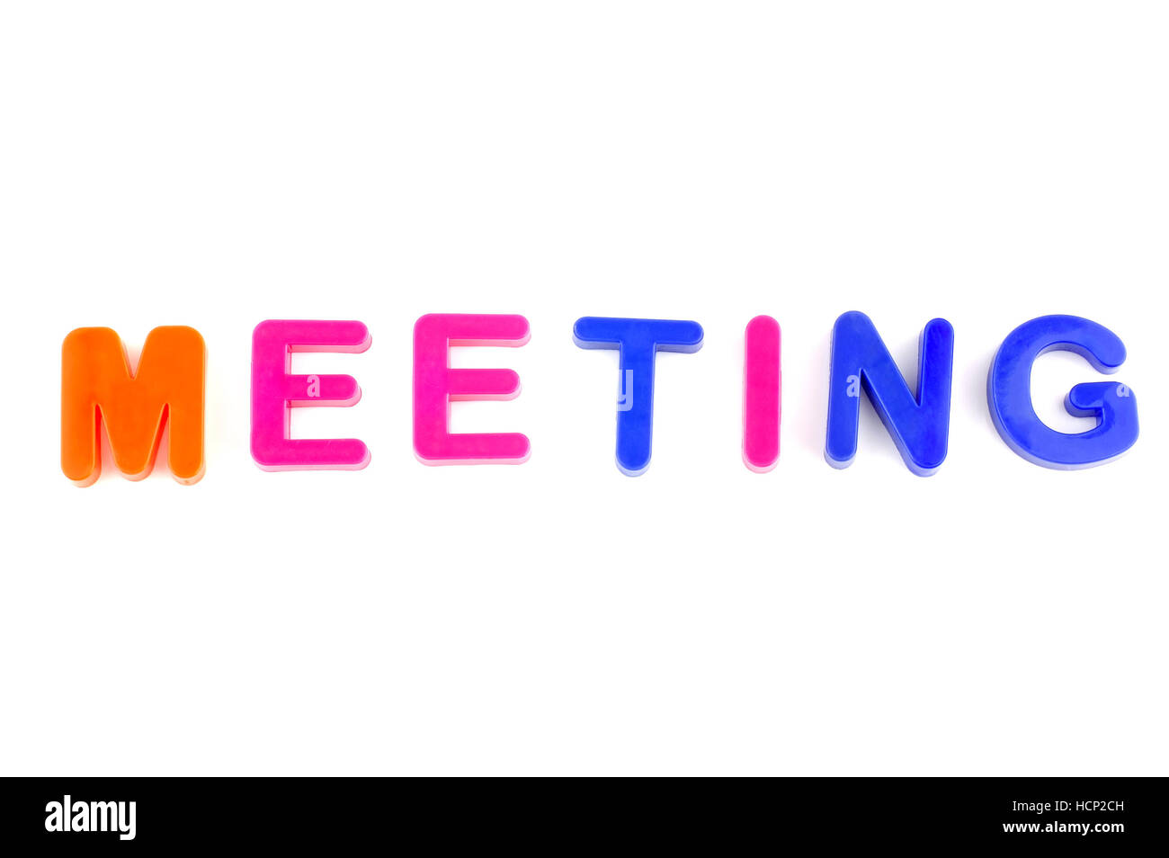Word meeting isolated on white background made from colorful toys ...