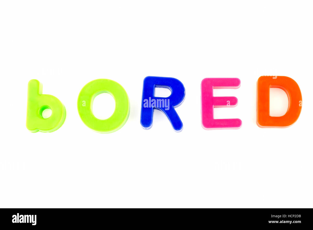 Word bored isolated on white background made from colorful toys letters ...