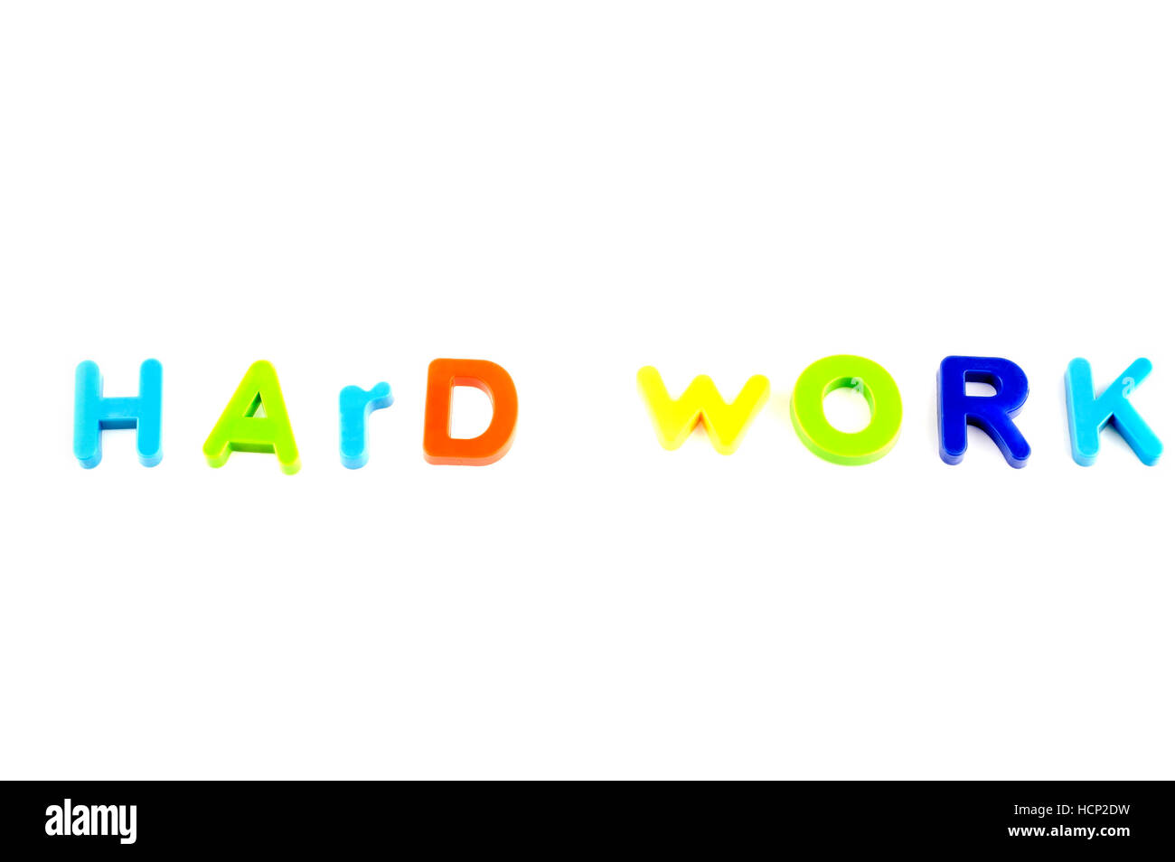 Word hardwork isolated on white background made from colorful toys ...