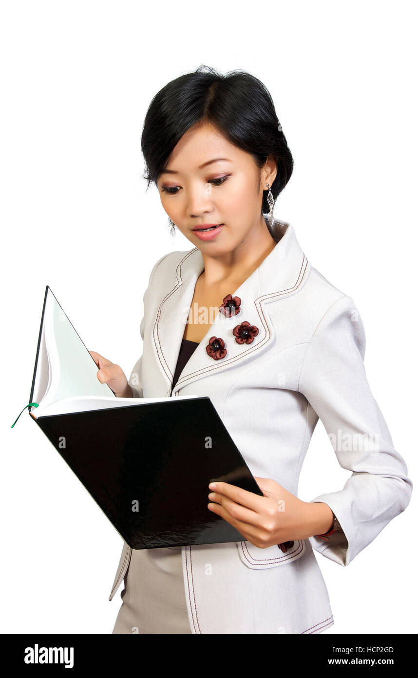 Business woman shock looking at the book. She seems stress looking at ...