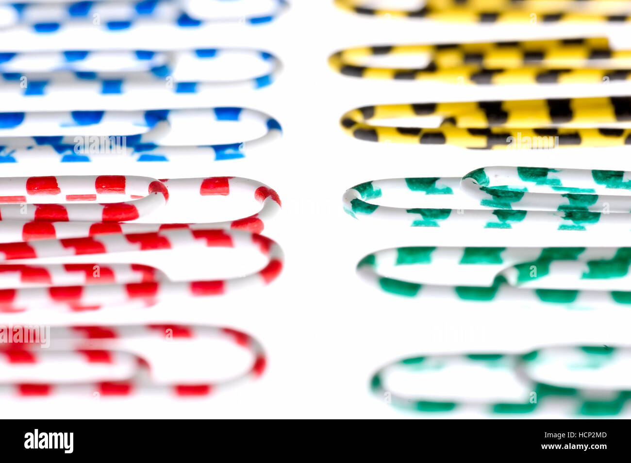 Paperclips on a white isolated background Stock Photo - Alamy