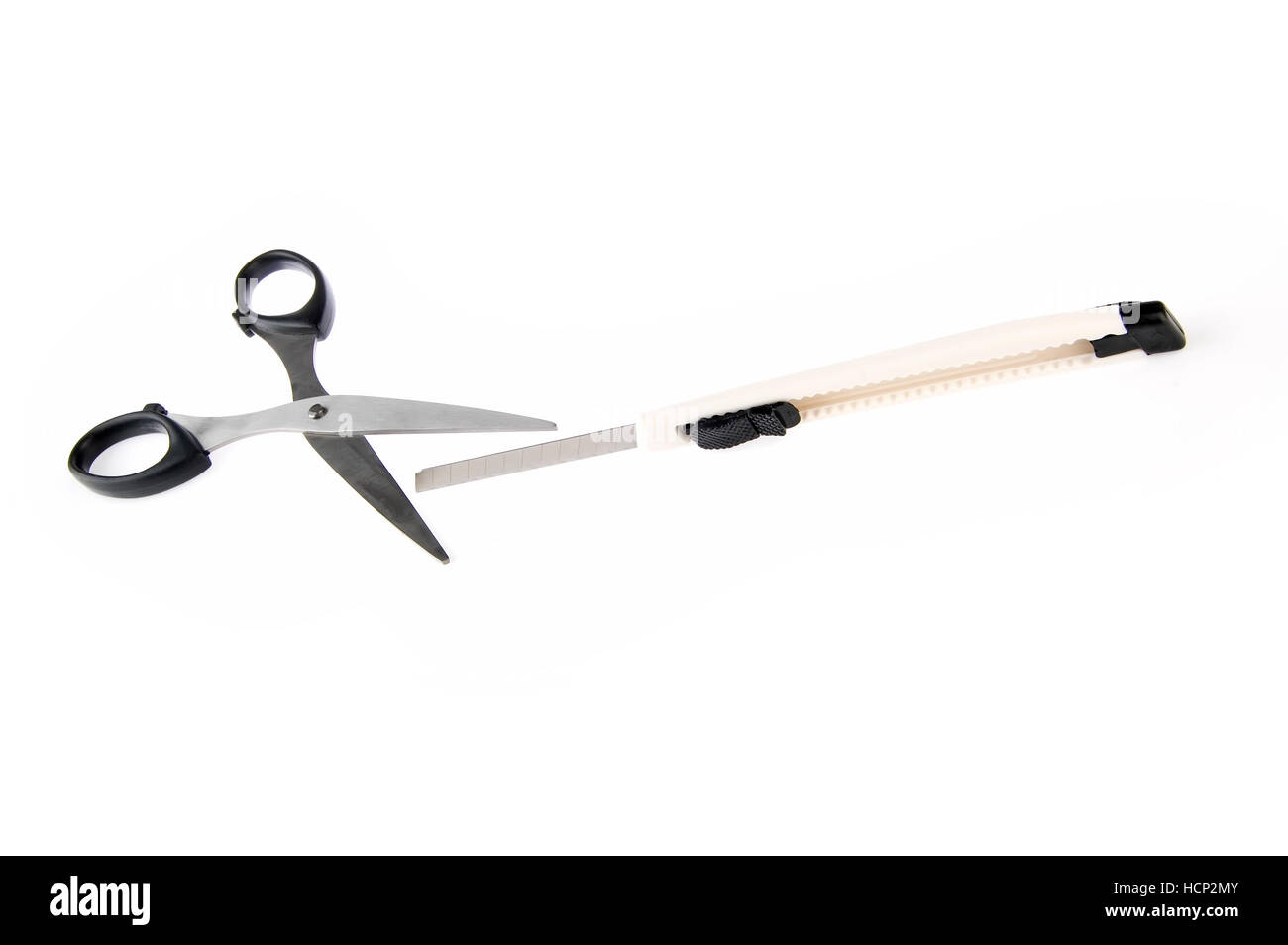 Scissors and paper cutter on white background Stock Photo - Alamy
