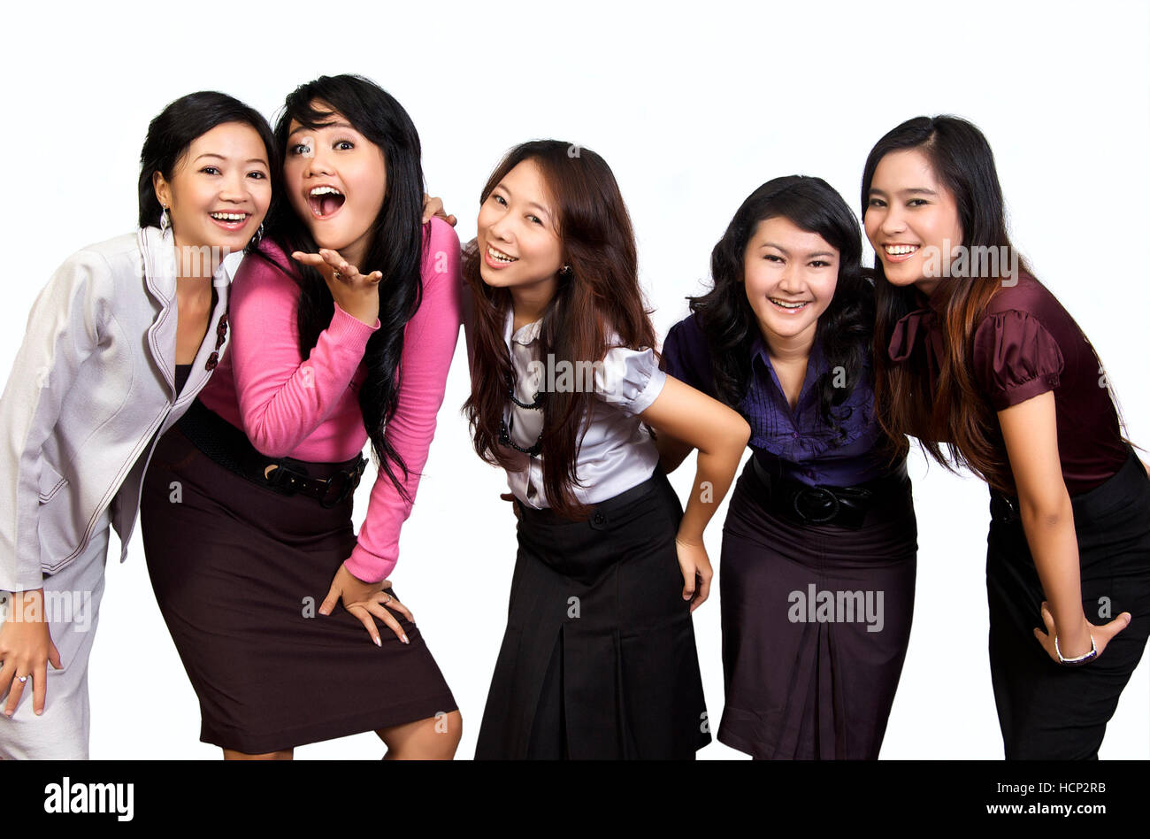 Happy group of attractive young women smiling isolated on white ...