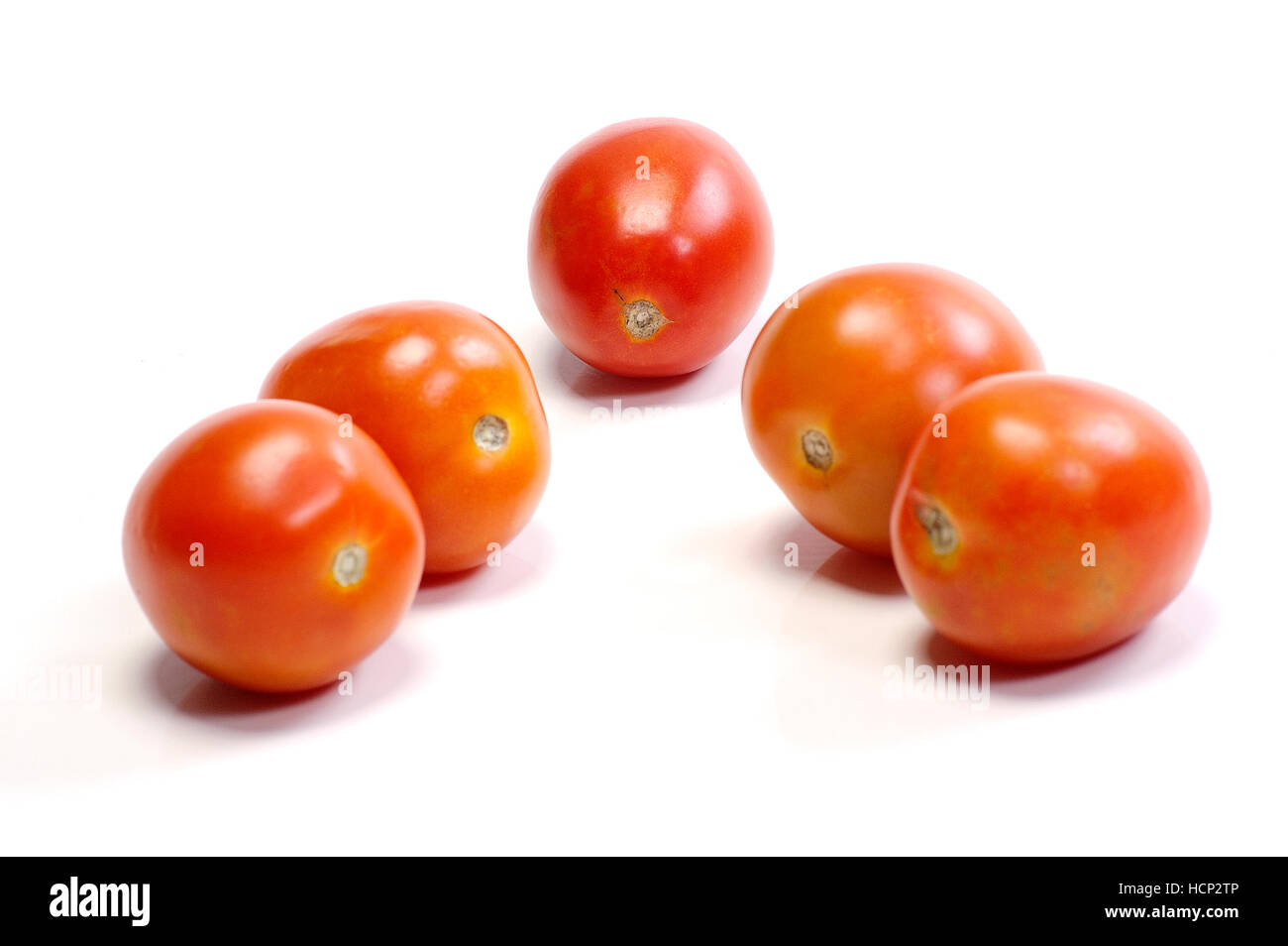 Five tomatoes on white background. Look tasty and fresh Stock Photo - Alamy