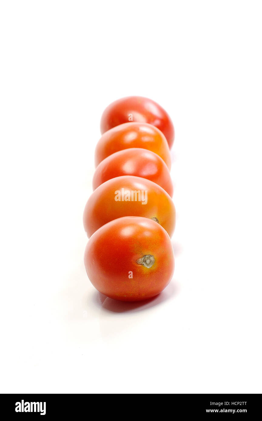 Five tomatoes on white background. Look tasty and fresh Stock Photo - Alamy