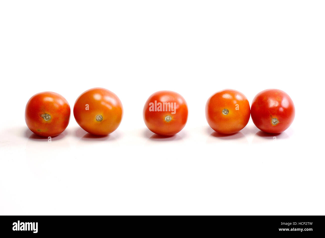 Five tomatoes Cut Out Stock Images & Pictures - Alamy