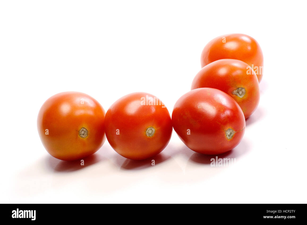 Five tomatoes on white background. Look tasty and fresh Stock Photo - Alamy