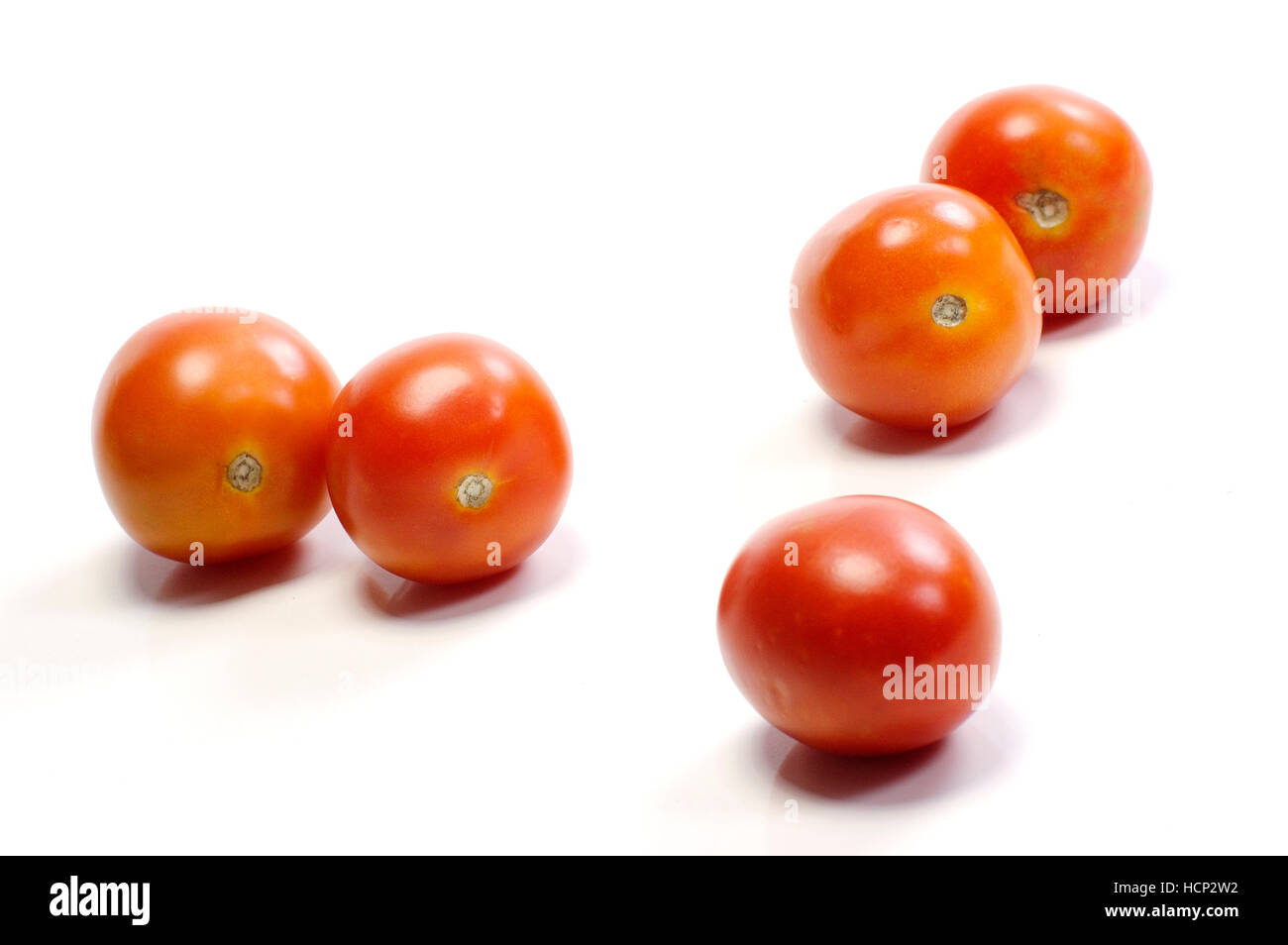 Five tomatoes on white background. Look tasty and fresh Stock Photo - Alamy